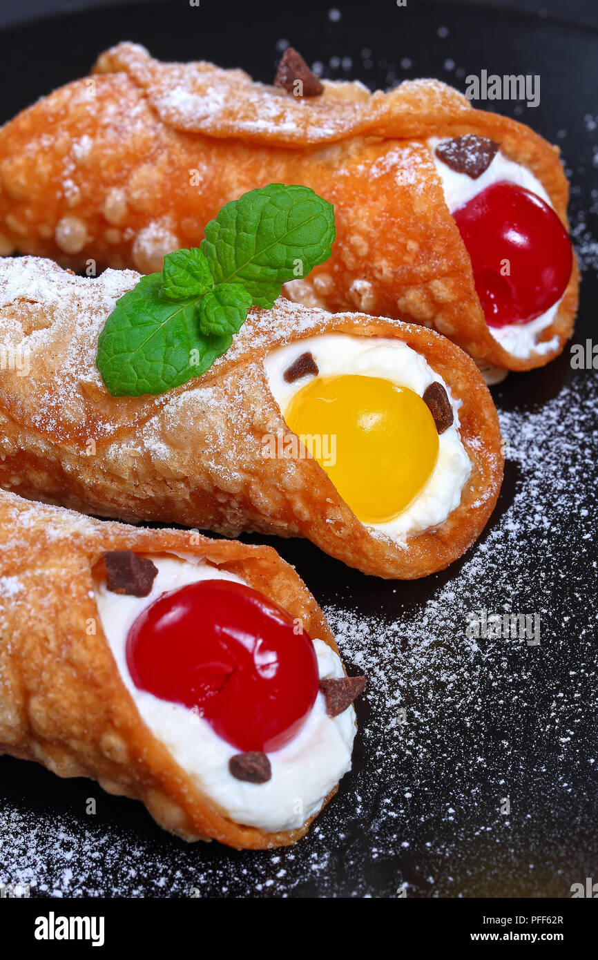yummy Sicilian Cannoli, traditional italian dessert, filling with ...