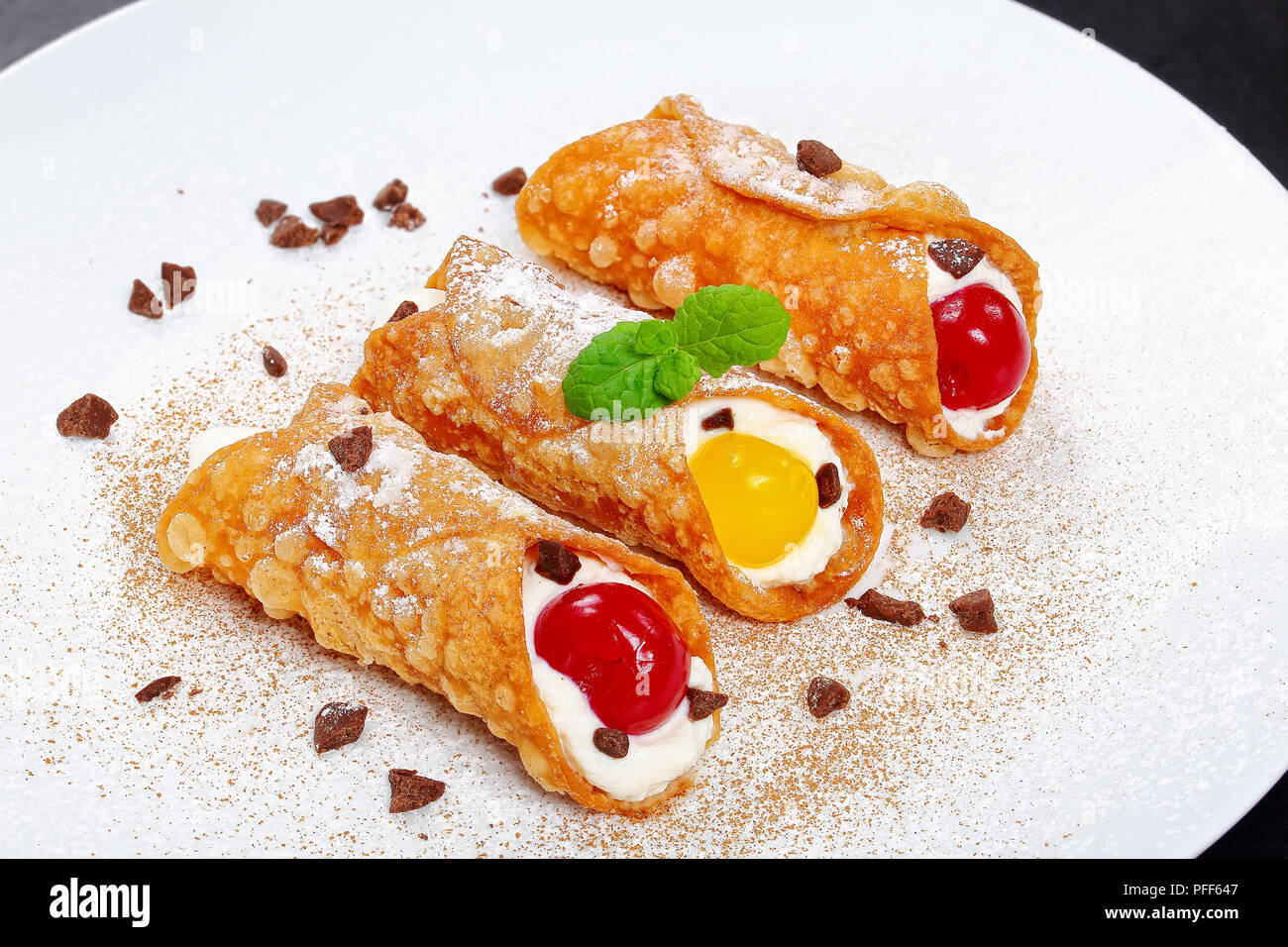 delicious homemade italian dessert - Sicilian Cannoli, filling with ...