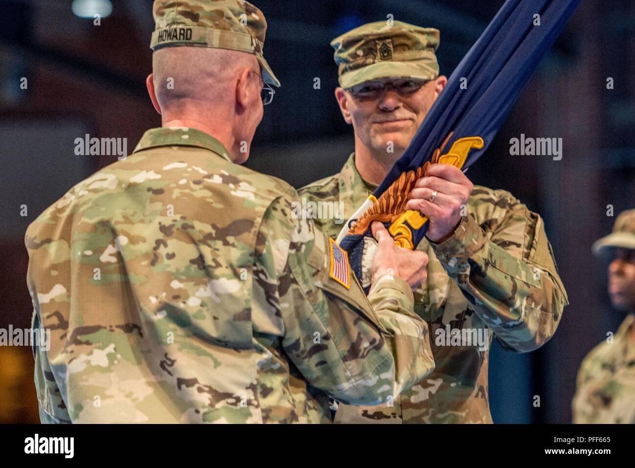 Command Sgt. Maj. Richard A. Woodring (right), assumes responsibility ...