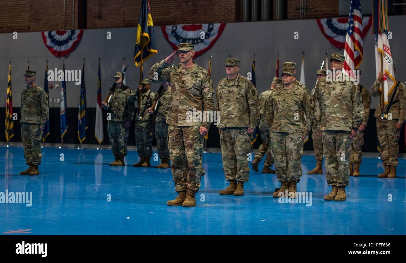 Command Sgt. Maj. Richard A. Woodring (center), salutes after assuming ...