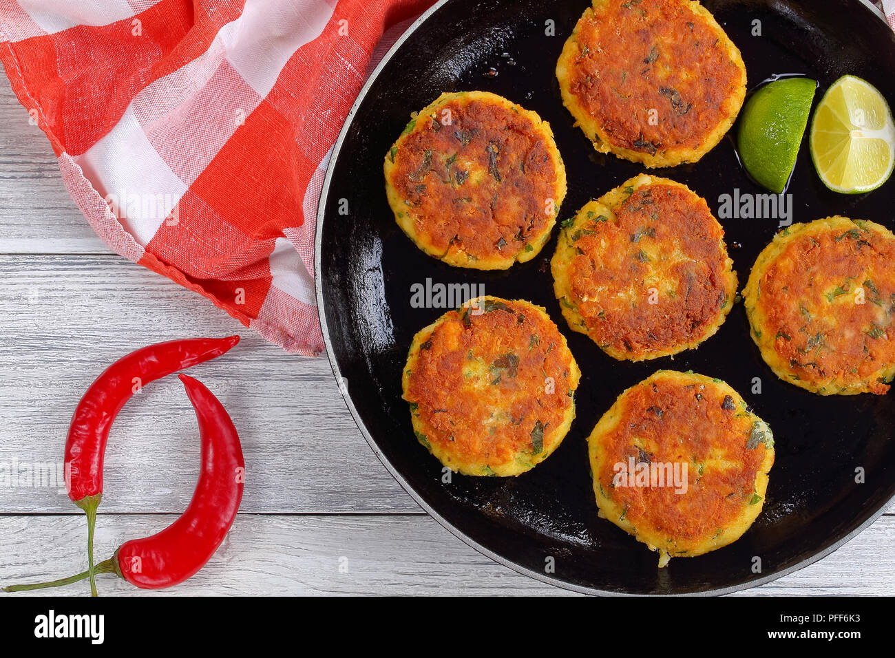 delicious fresh fried homemade fish cakes with mashed potato on skillet ...