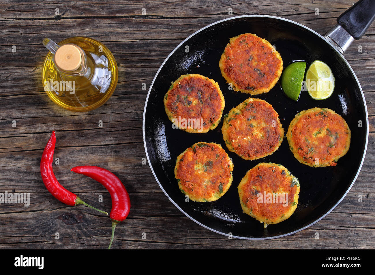 delicious fresh fried homemade fish cakes with mashed potato on skillet ...