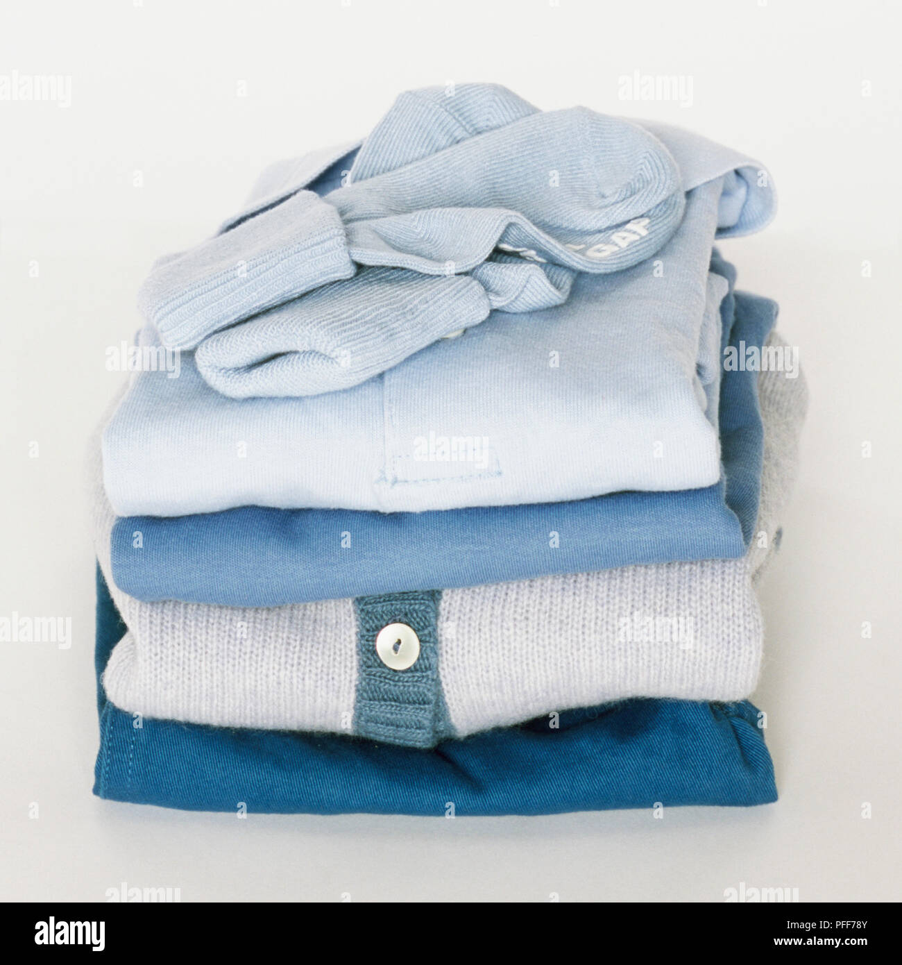A pile of clothes folded neatly in a pile Stock Photo - Alamy