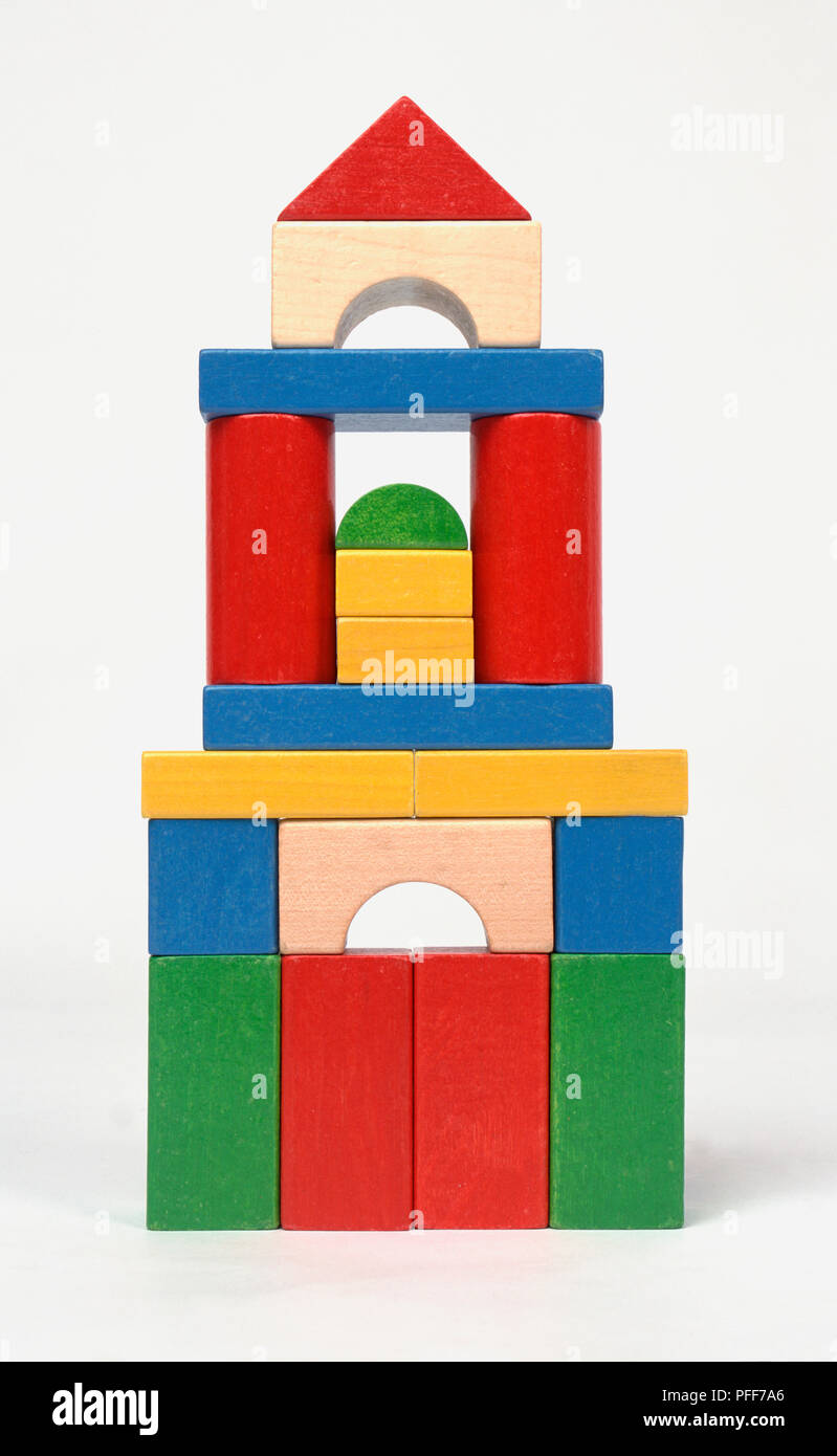 Tower made from coloured wooden building blocks Stock Photo - Alamy