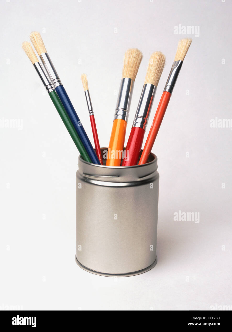 Metal tin of paintbrushes in various sizes Stock Photo - Alamy