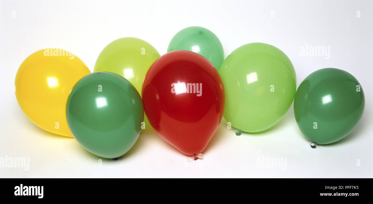 Green, red and yellow inflated balloons, side view Stock Photo - Alamy