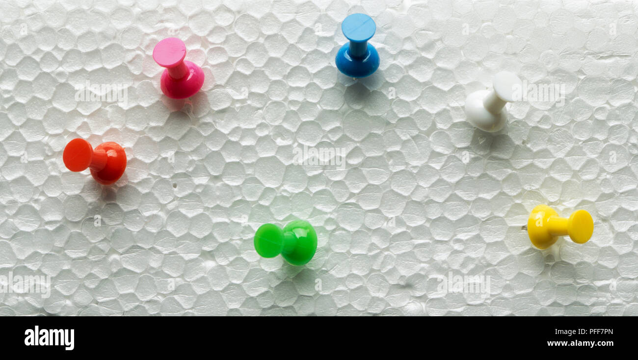Drawing pins in polystyrene Stock Photo - Alamy