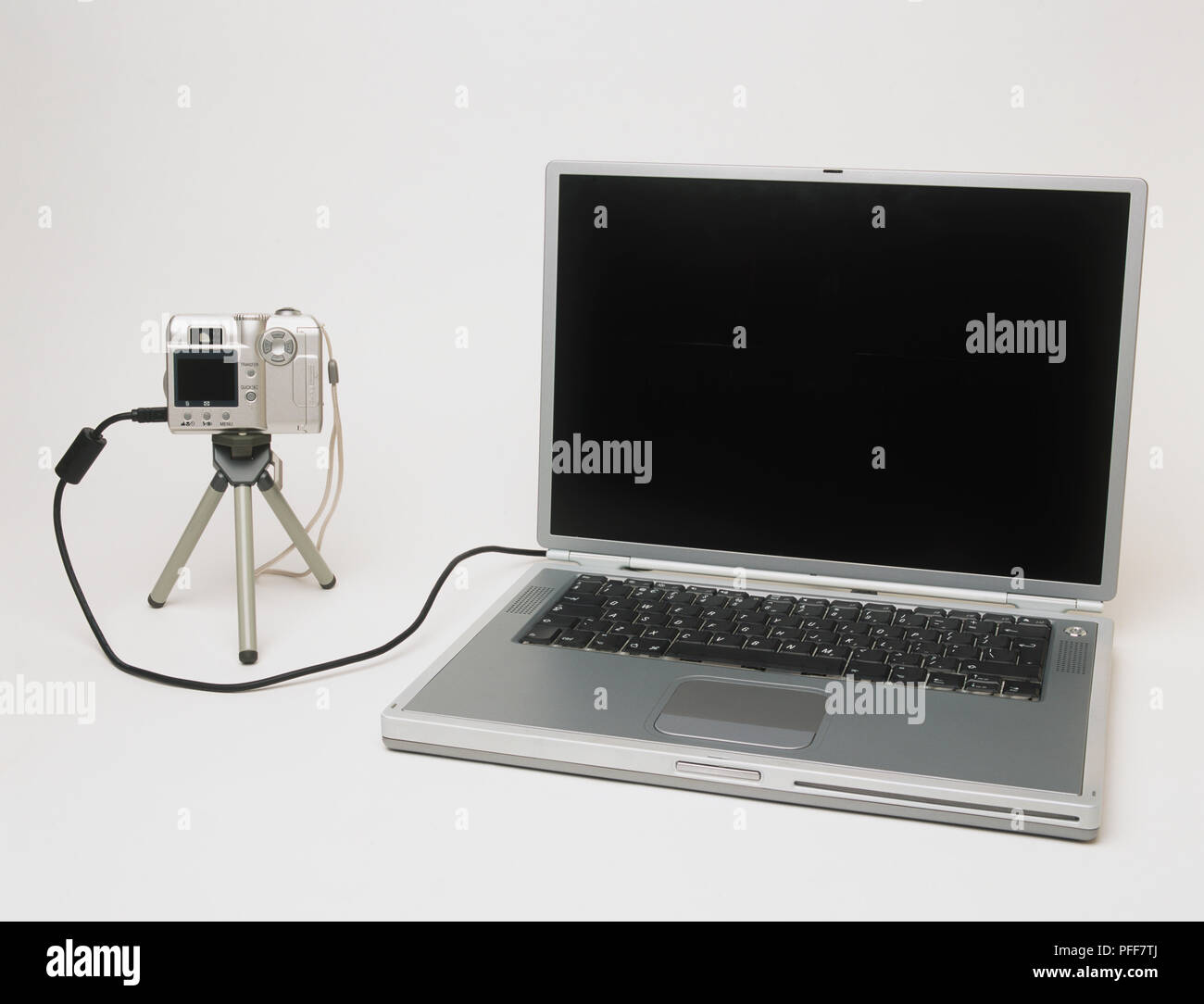 Digital camera attached to laptop Stock Photo - Alamy