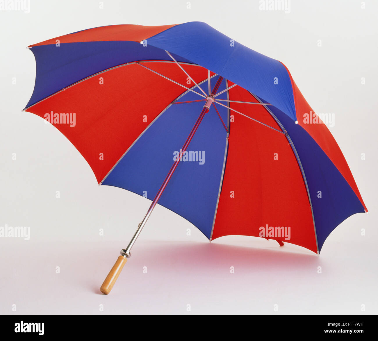 Blue and red opened umbrella, front view Stock Photo - Alamy