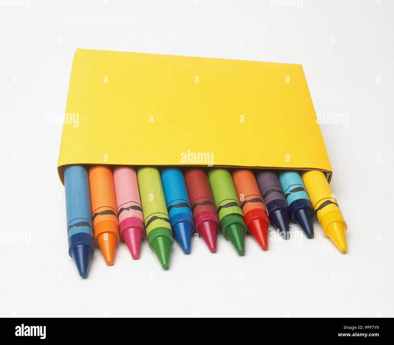 Tips of coloured crayons emerging from a yellow box, front view Stock ...