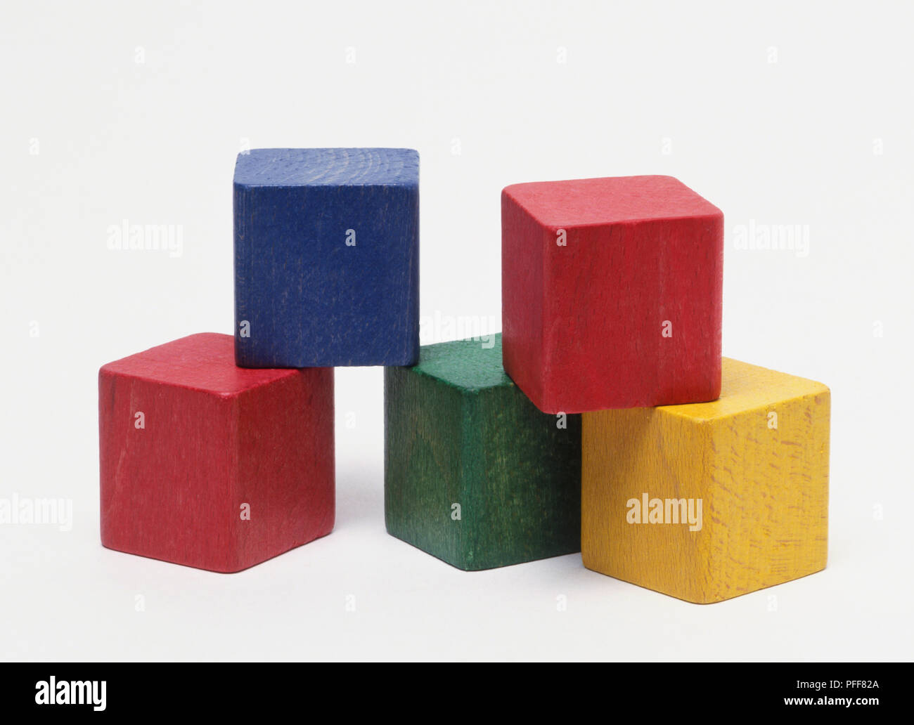 Five coloured wood building blocks Stock Photo - Alamy