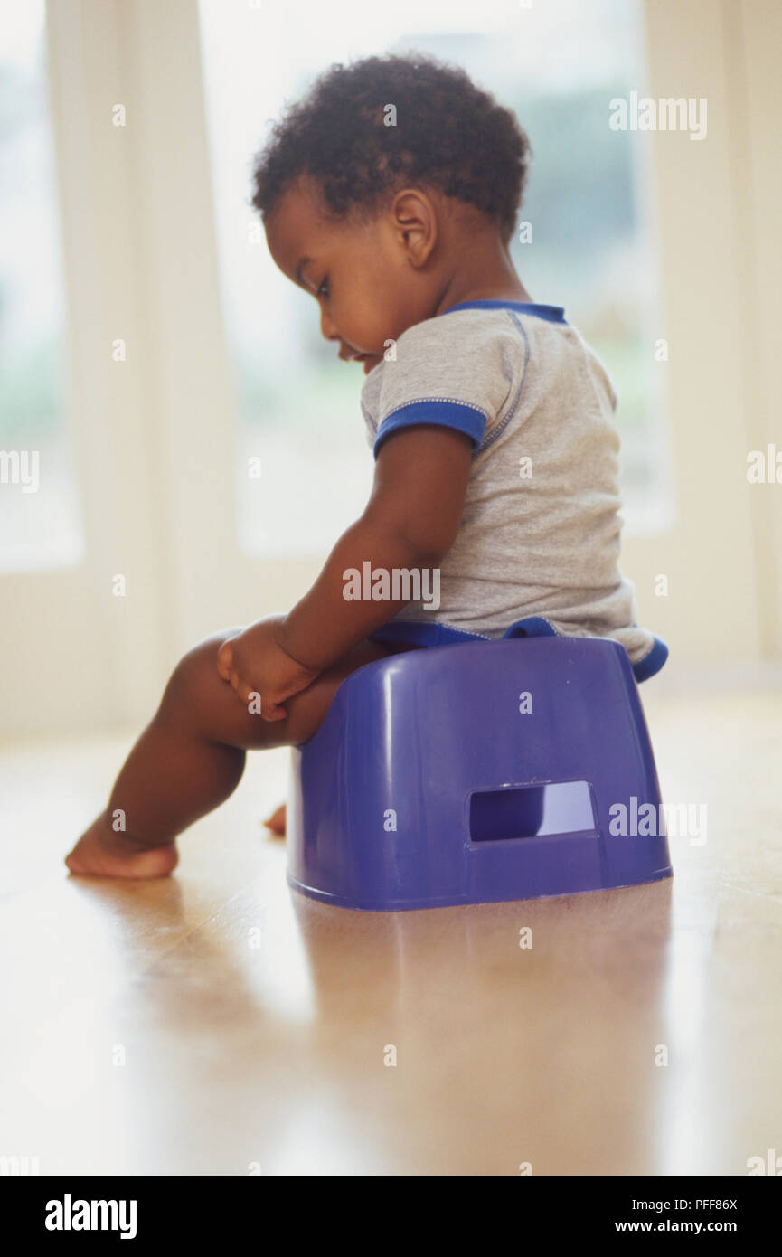 Child sitting on toilet potty hi-res stock photography and images - Alamy