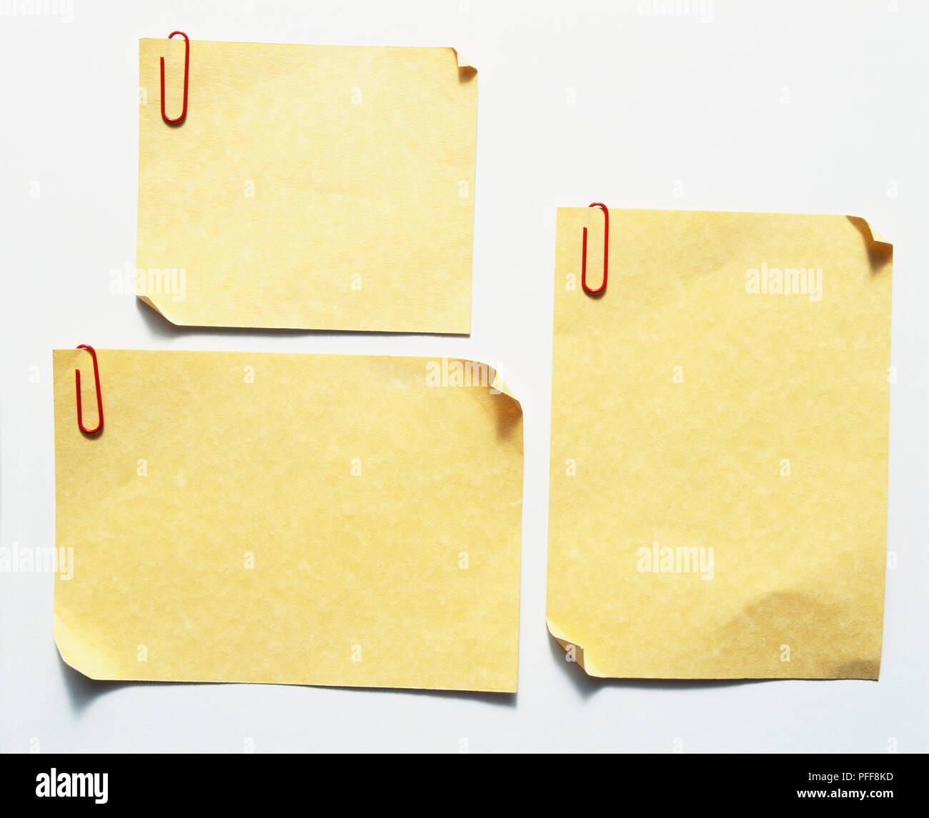 Post-it notes with red paper clips attached at top Stock Photo - Alamy