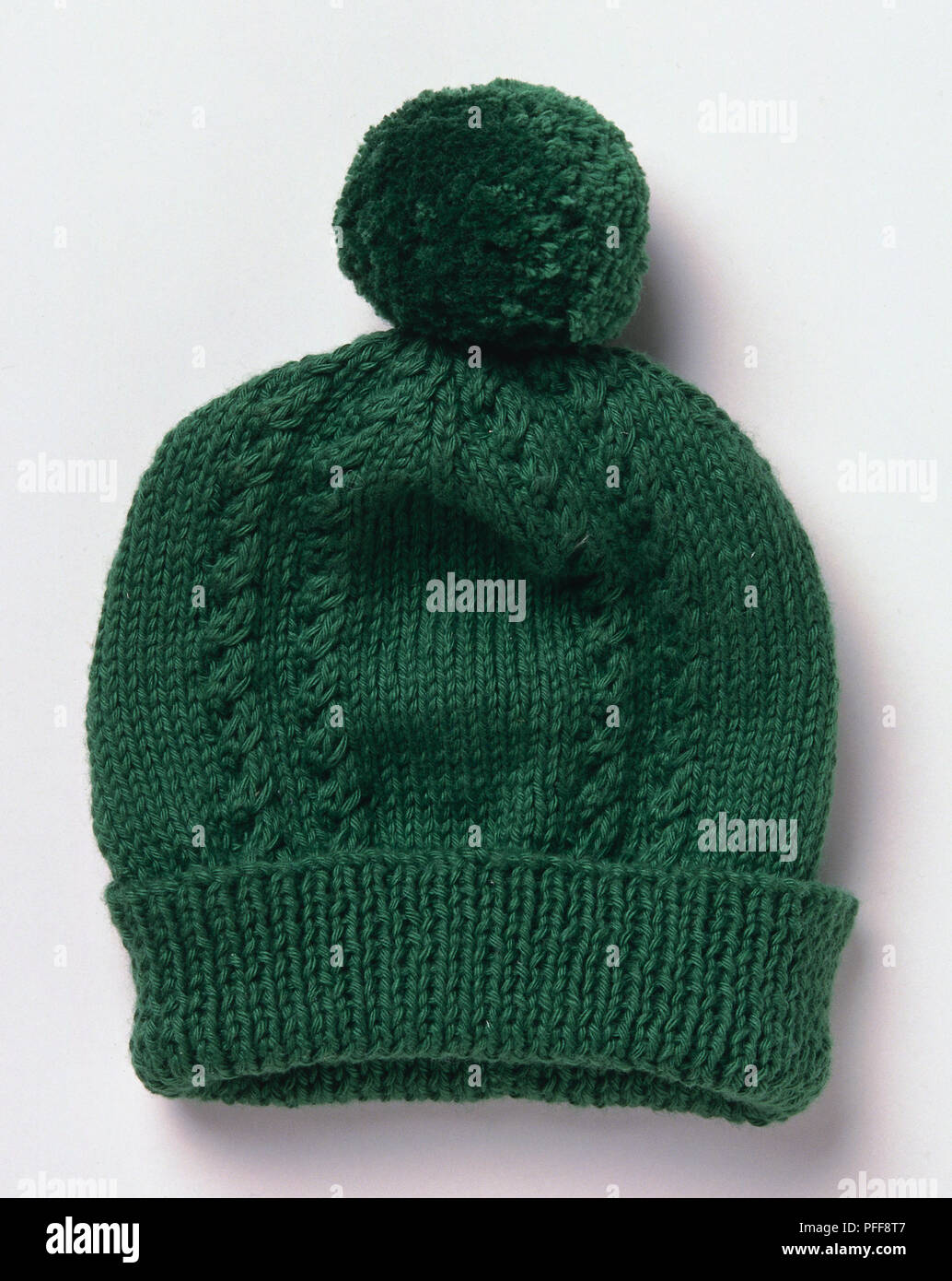 Green woollen bobble hat Stock Photo - Alamy
