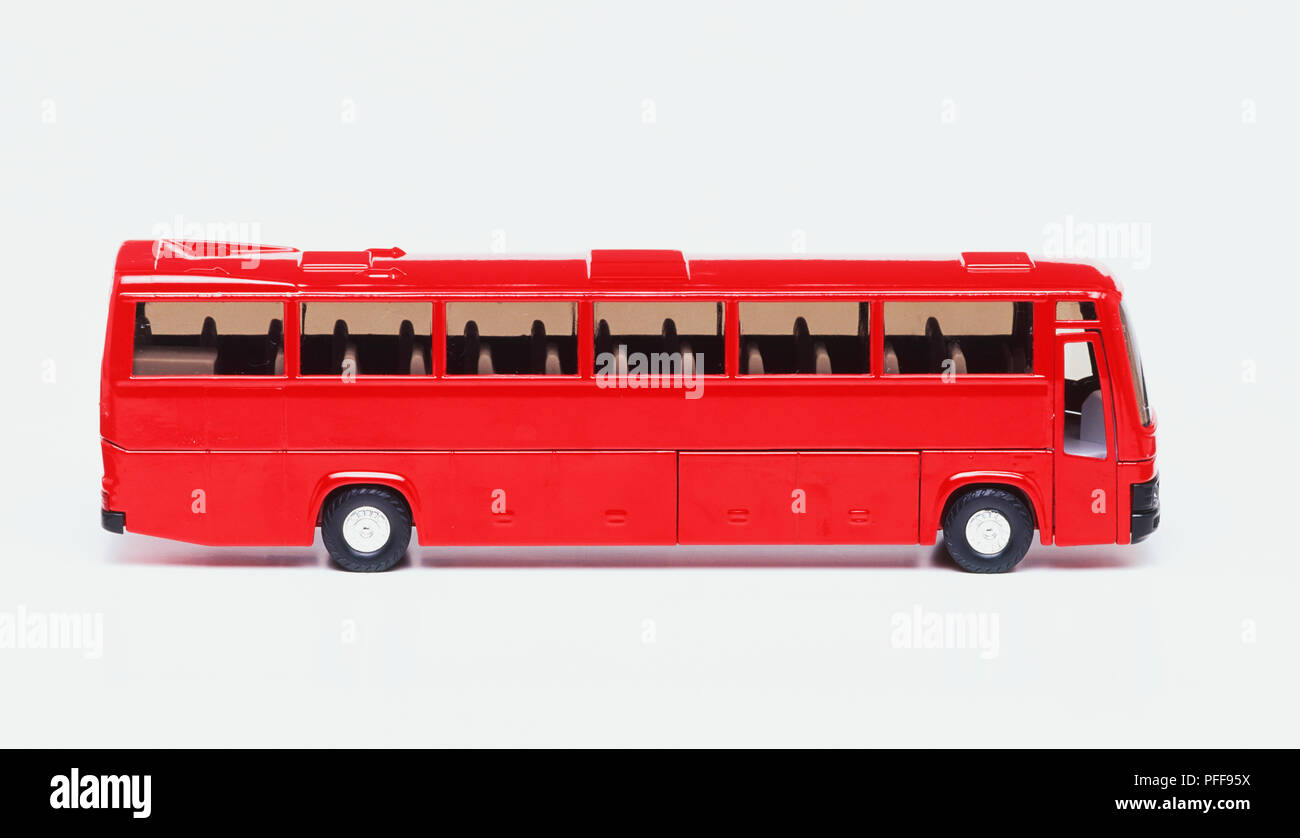 Model of red bus, side view Stock Photo - Alamy