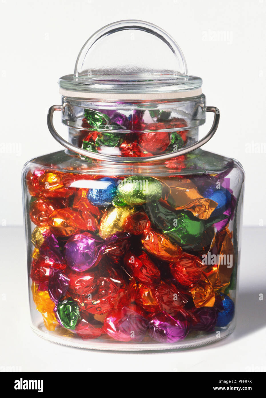 Sweet jar filled with wrapped sweets Stock Photo - Alamy