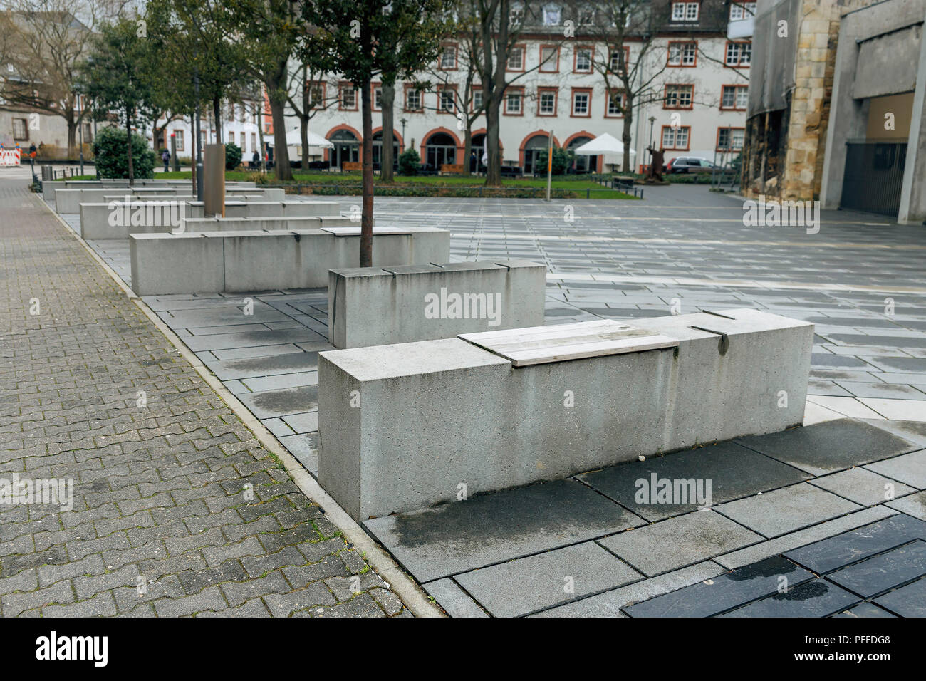close-up of a modern concrete bench with a wooden floor Stock Photo - Alamy