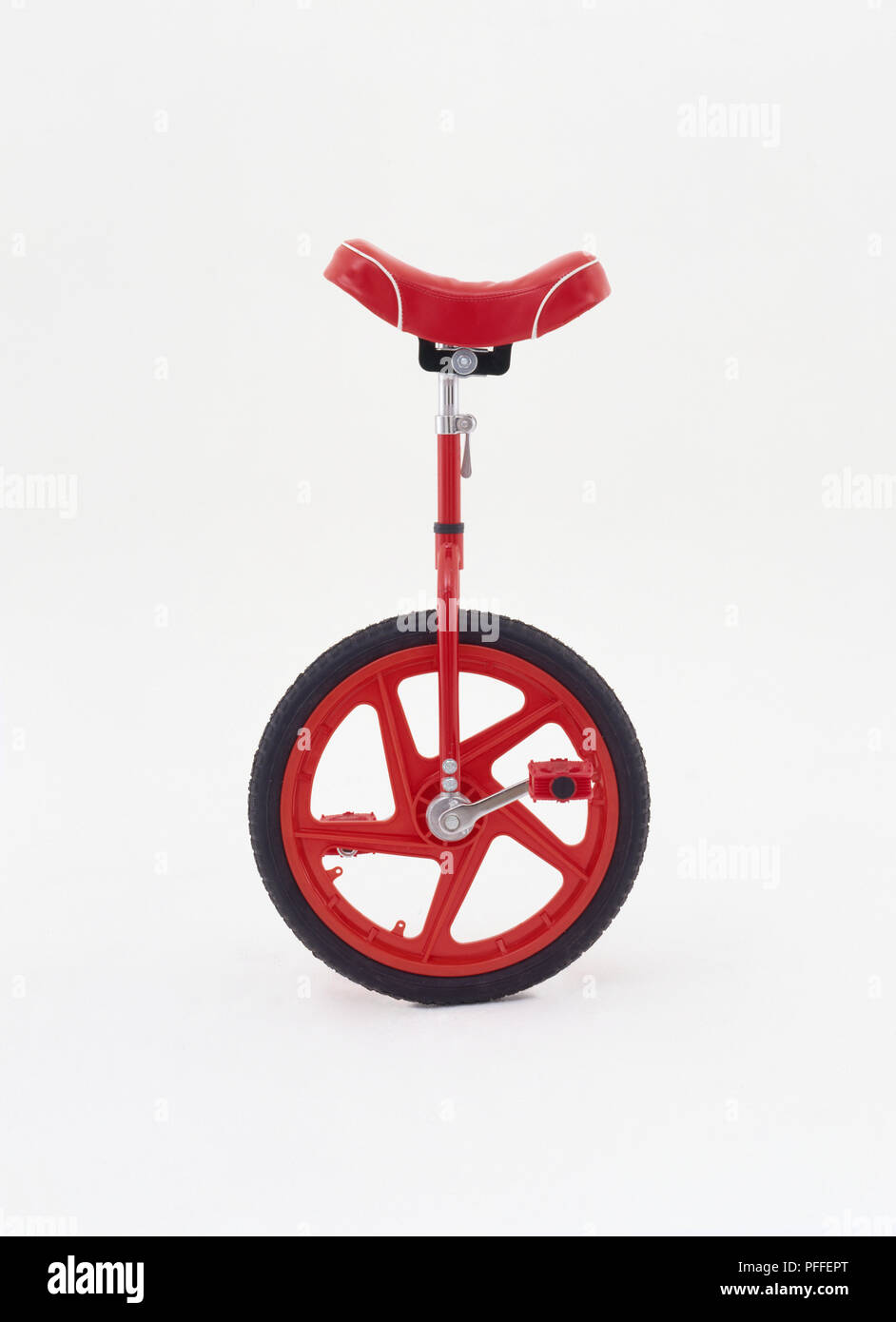 Red unicycle, close-up Stock Photo - Alamy