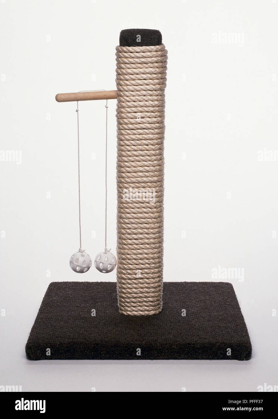 A cat scratching post Stock Photo - Alamy