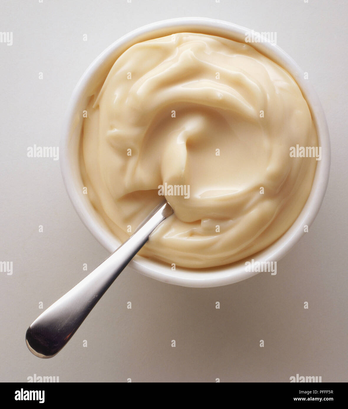 Bowl of mayonnaise with spoon embedded, view from above Stock Photo - Alamy