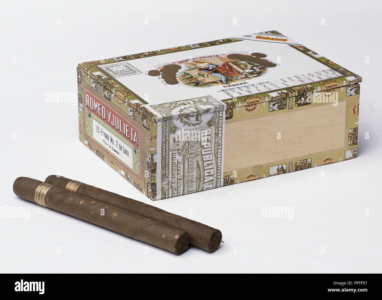 Box of Cuban cigars with two cigars outside Stock Photo - Alamy