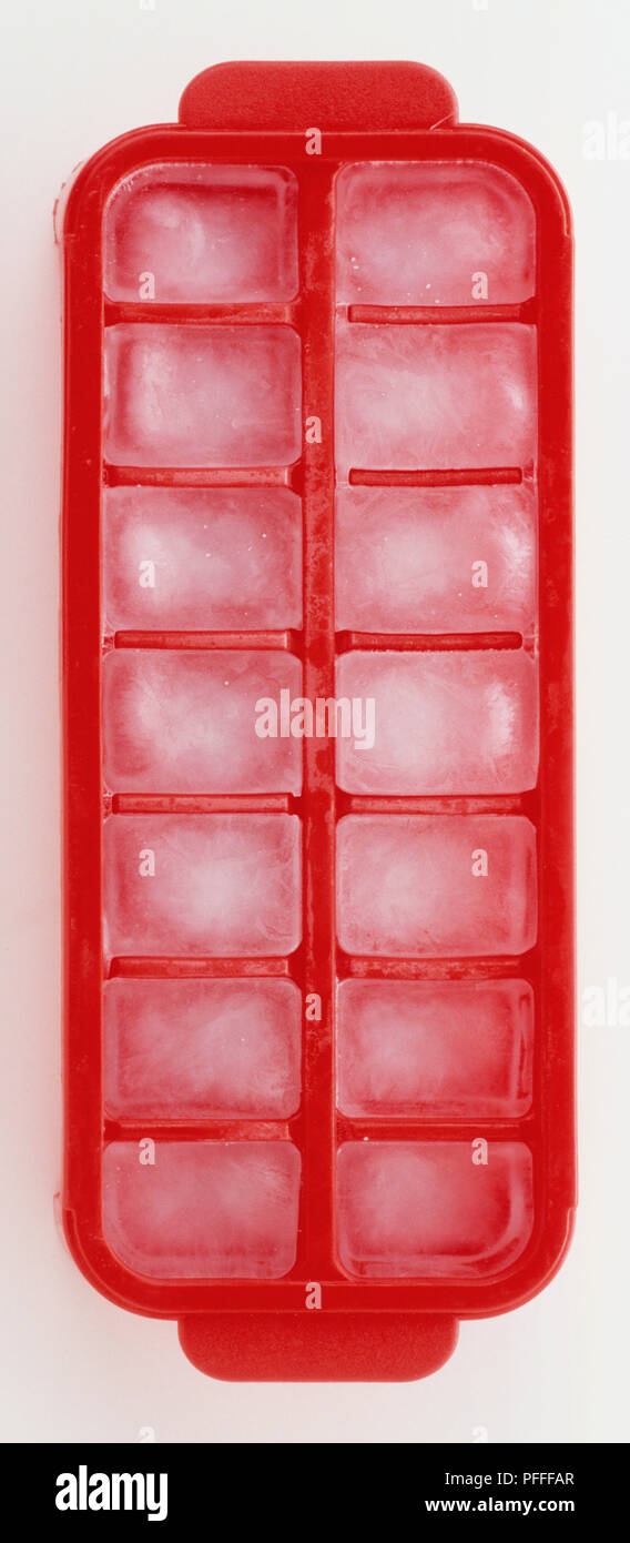 Ice cubes in red tray Stock Photo - Alamy