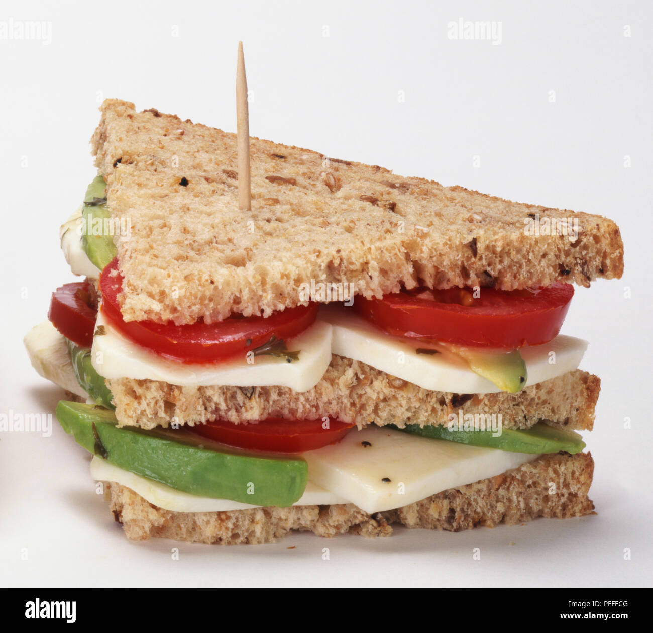 Front view Triple Decker Sandwich with Mozzarella, Avocado and Tomatoes ...