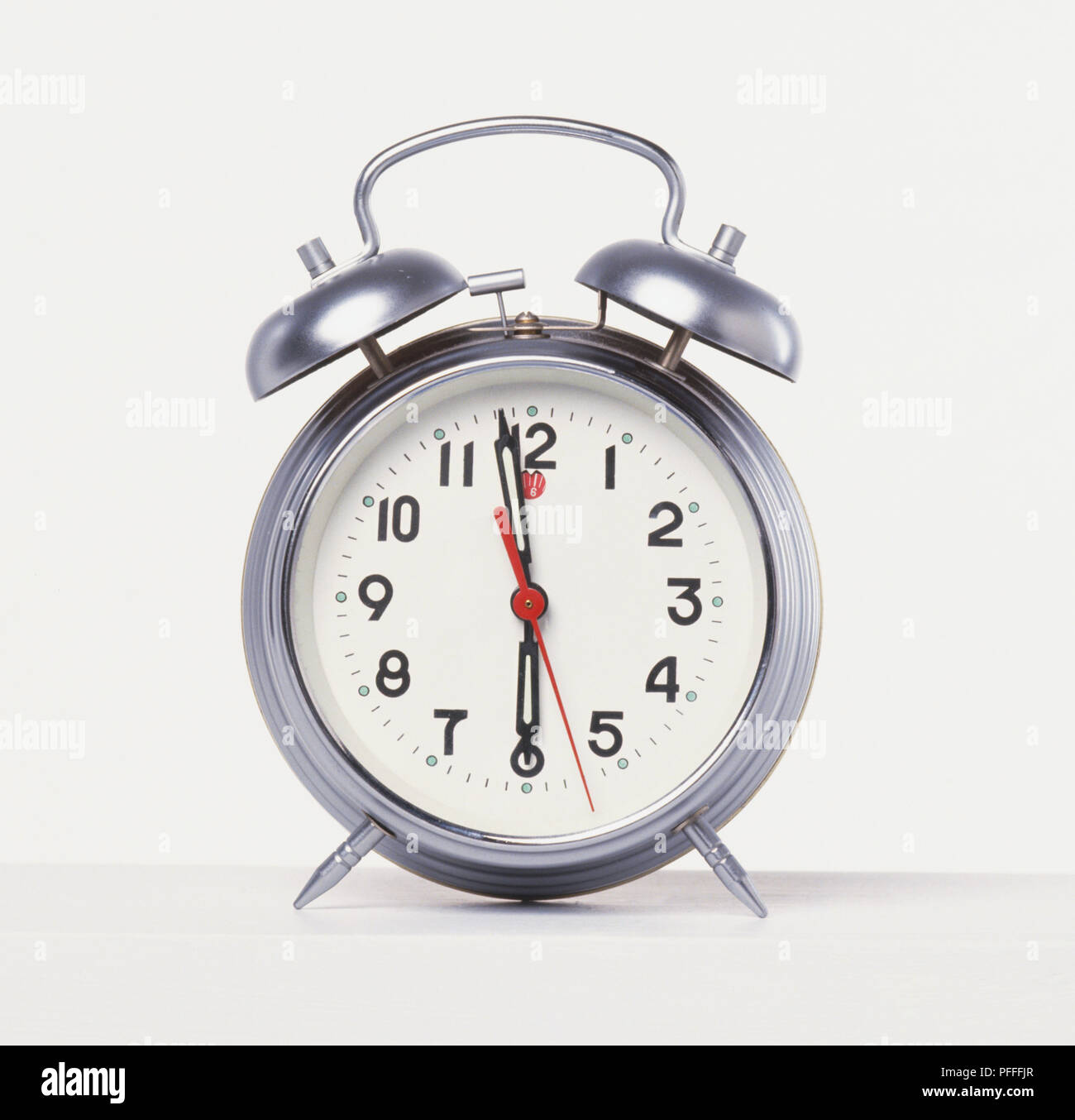 Analogue silver alarm clock with bells, close up Stock Photo - Alamy