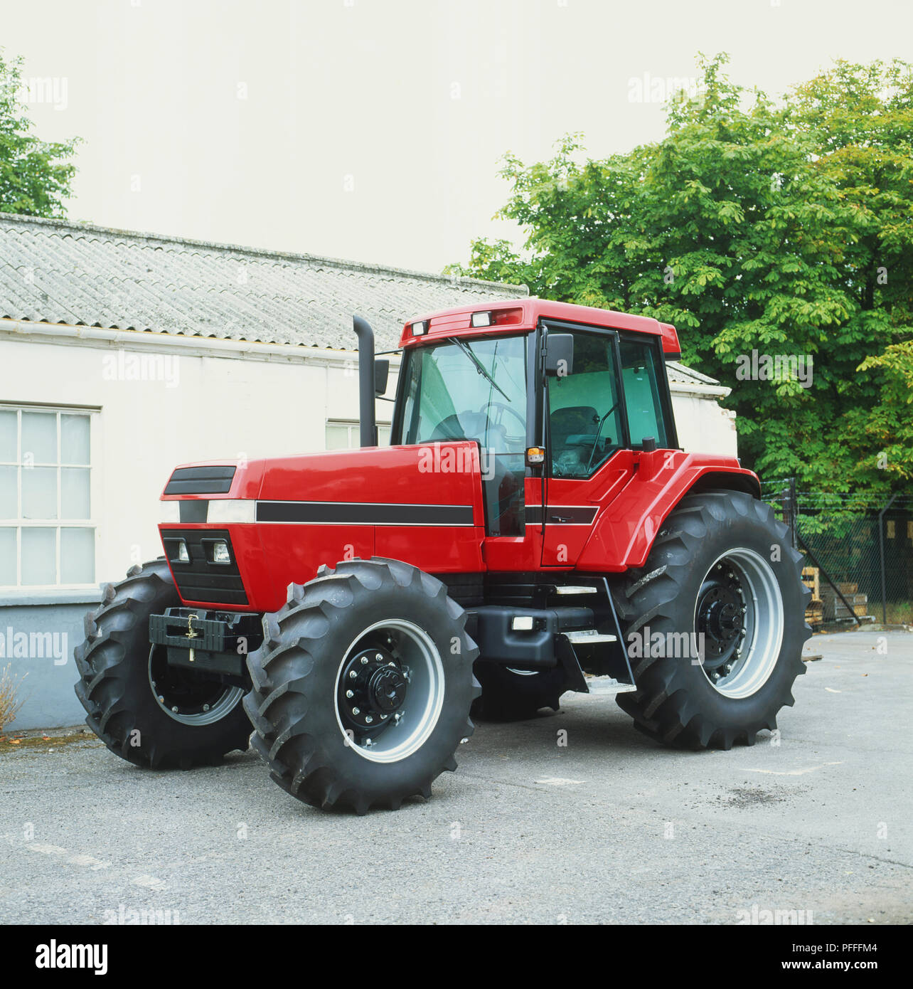 A red coloured tractor Stock Photo - Alamy