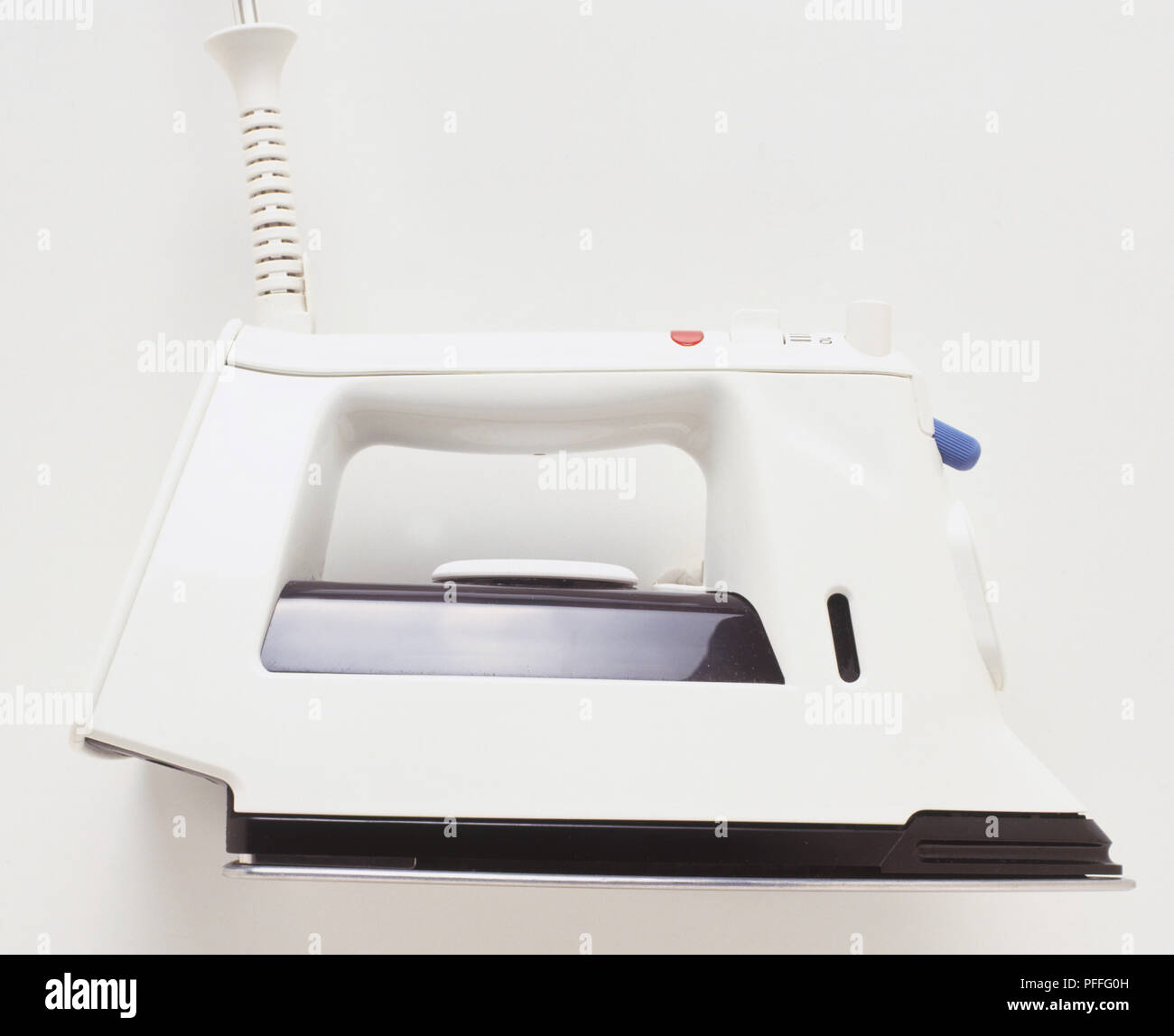 Ironing with electric irons hi-res stock photography and images - Alamy