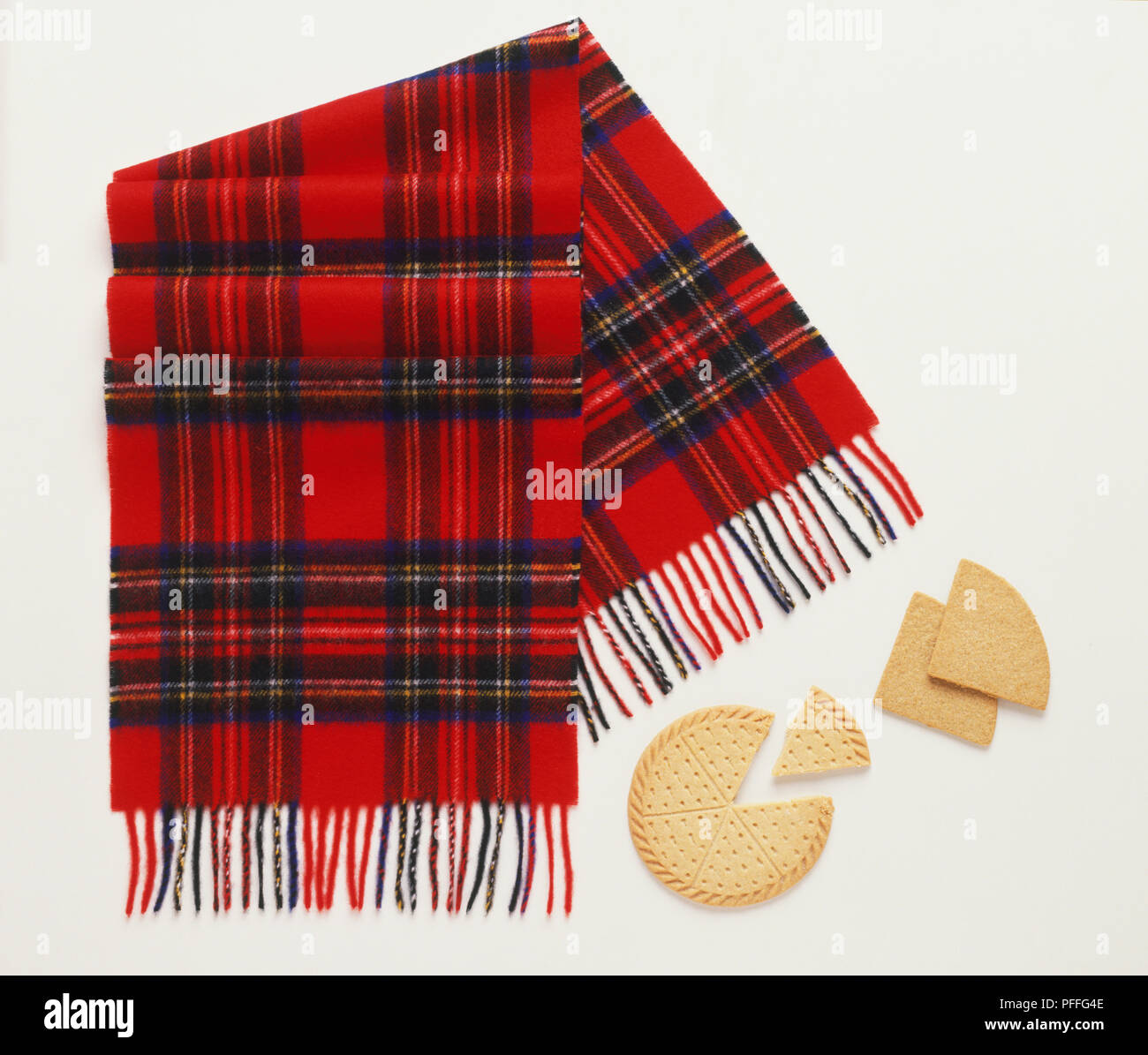 Red tartan scarf, Scottish shortbread triangles, front view Stock Photo ...