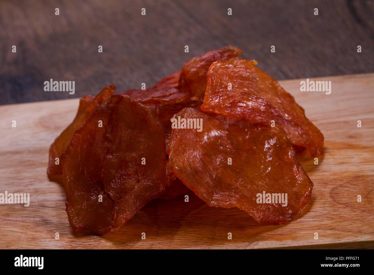Dry chicken meat over wooden Stock Photo - Alamy