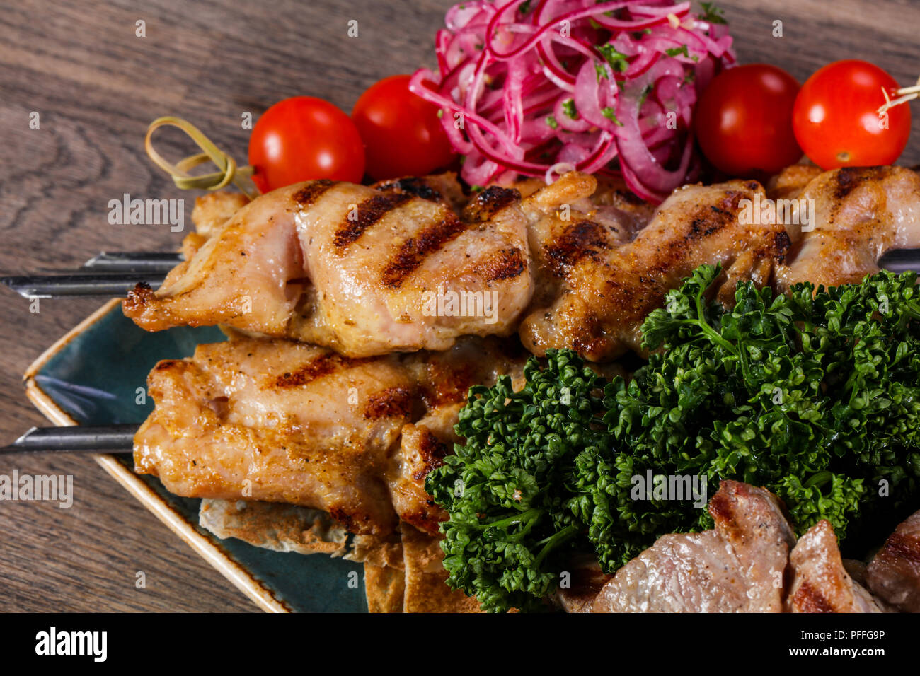 Grilled chicken and pork barbeque Stock Photo - Alamy