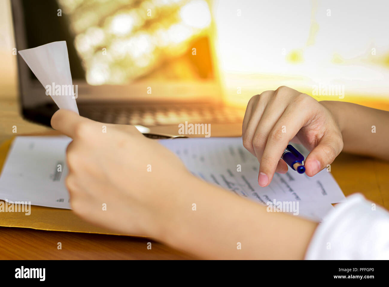 Business woman hand with pen and reading piece of paper documen Stock ...