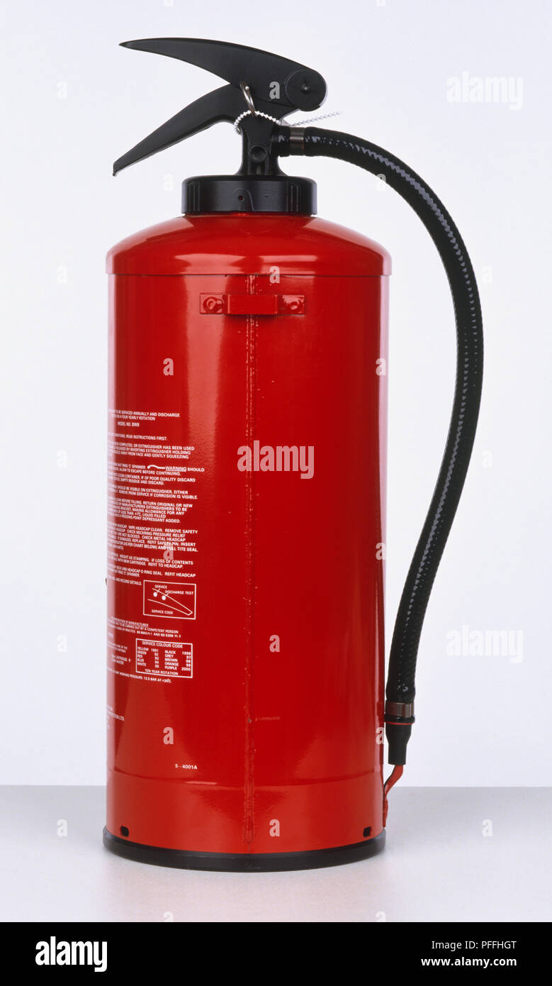 Red fire extinguisher Stock Photo - Alamy