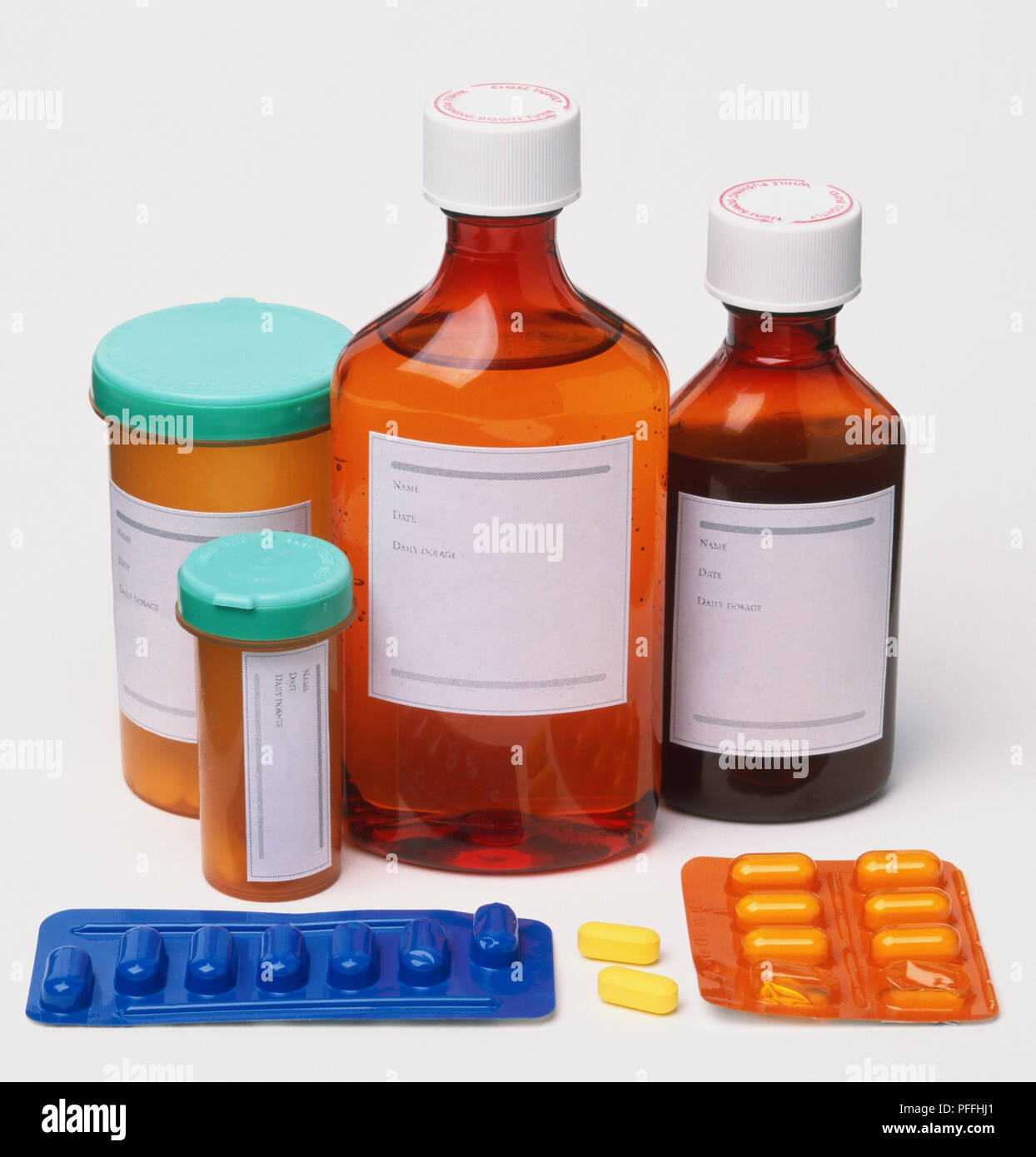 Bottles of medication, tablets in plastic strips and in plastic ...