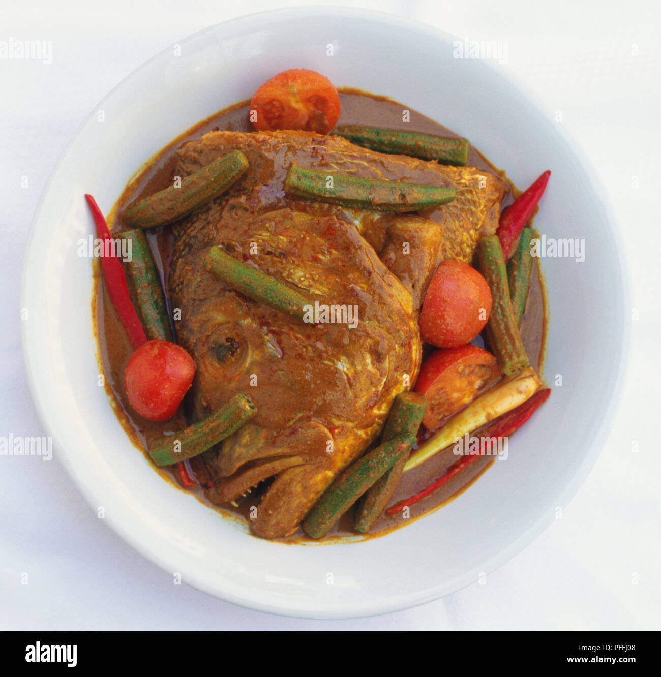 Indian cuisine, Fish-head curry, eye and teeth visible, spicy dish ...