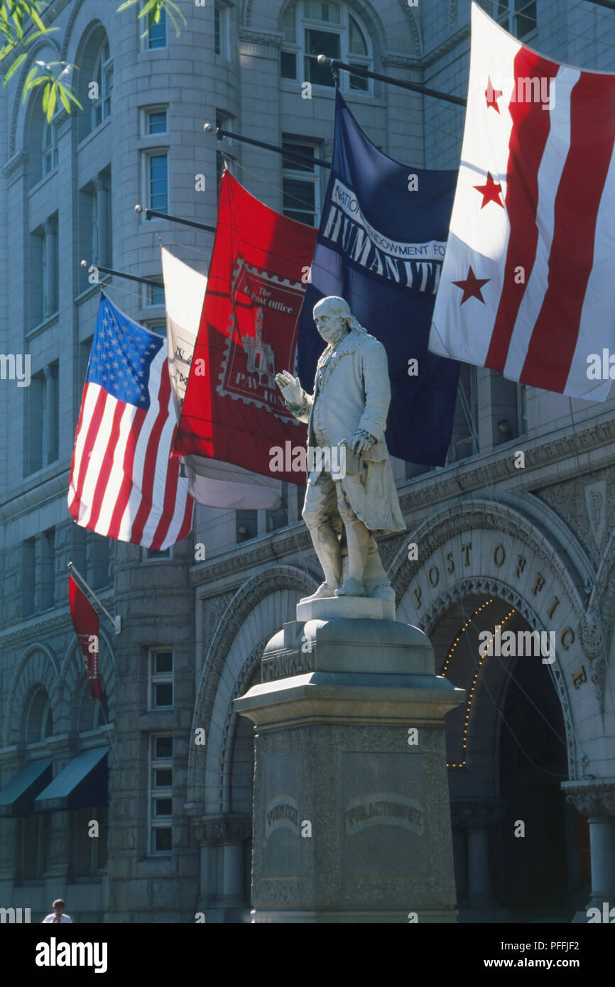 Statue of Benjamin Franklin outside the flag-festooned Old Post Office ...