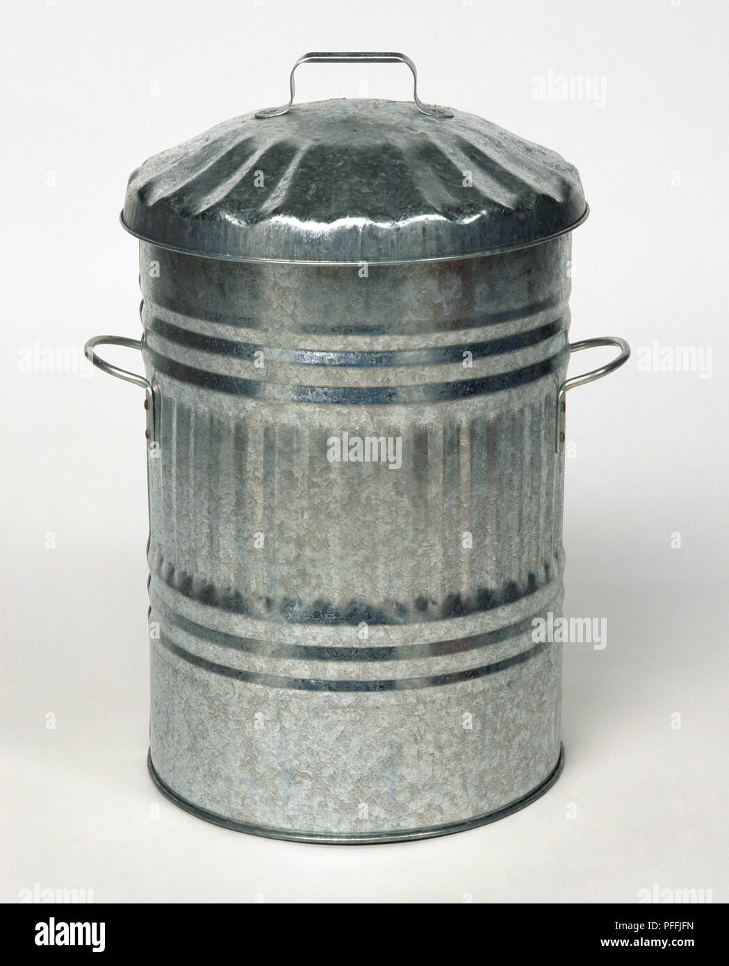 Galvanized dustbin with lid, front view Stock Photo - Alamy
