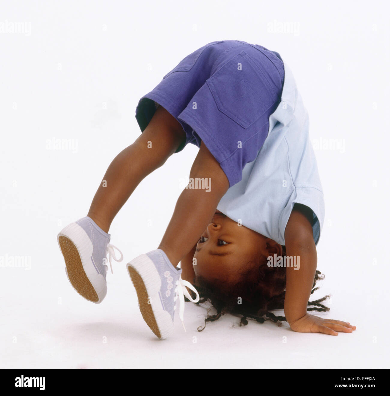 Girl doing somersault Stock Photo - Alamy