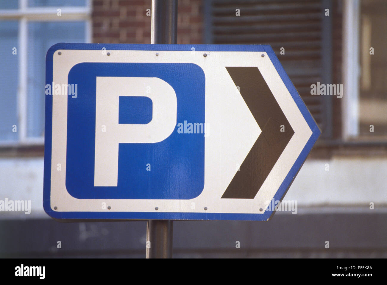 England, London, blue and white arrow-shaped sign for a car park Stock ...