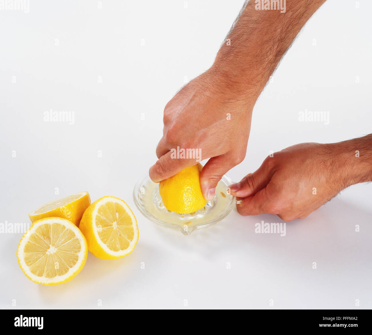 Man squeezing fresh lemon juice hi-res stock photography and images - Alamy