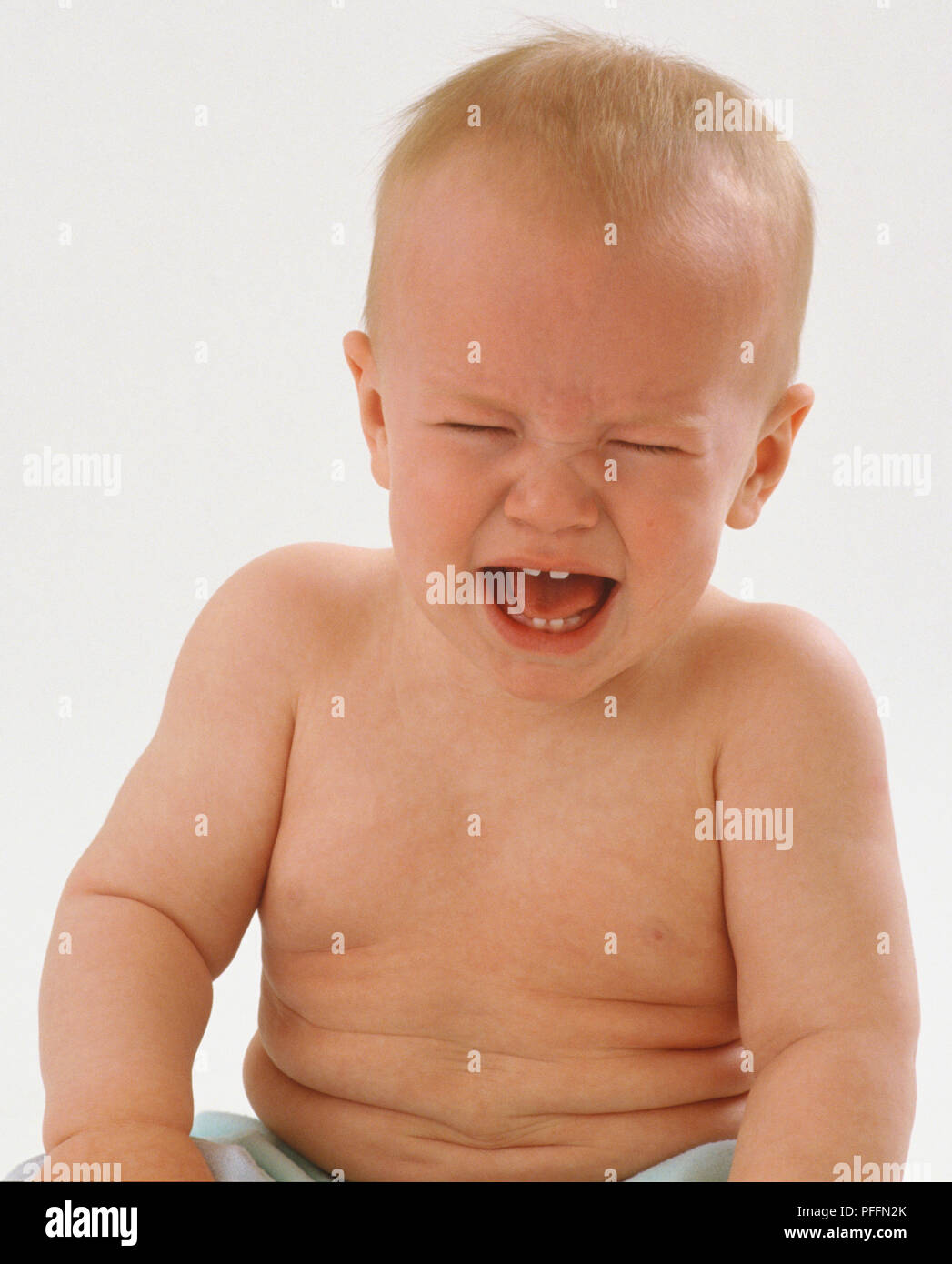 Baby sitting, crying, five milk teeth showing Stock Photo - Alamy