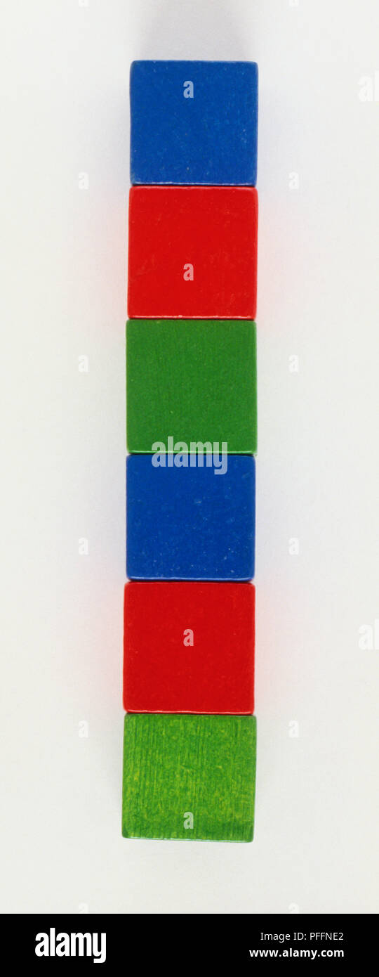 Six red, blue and green building blocks stacked on top of each other ...