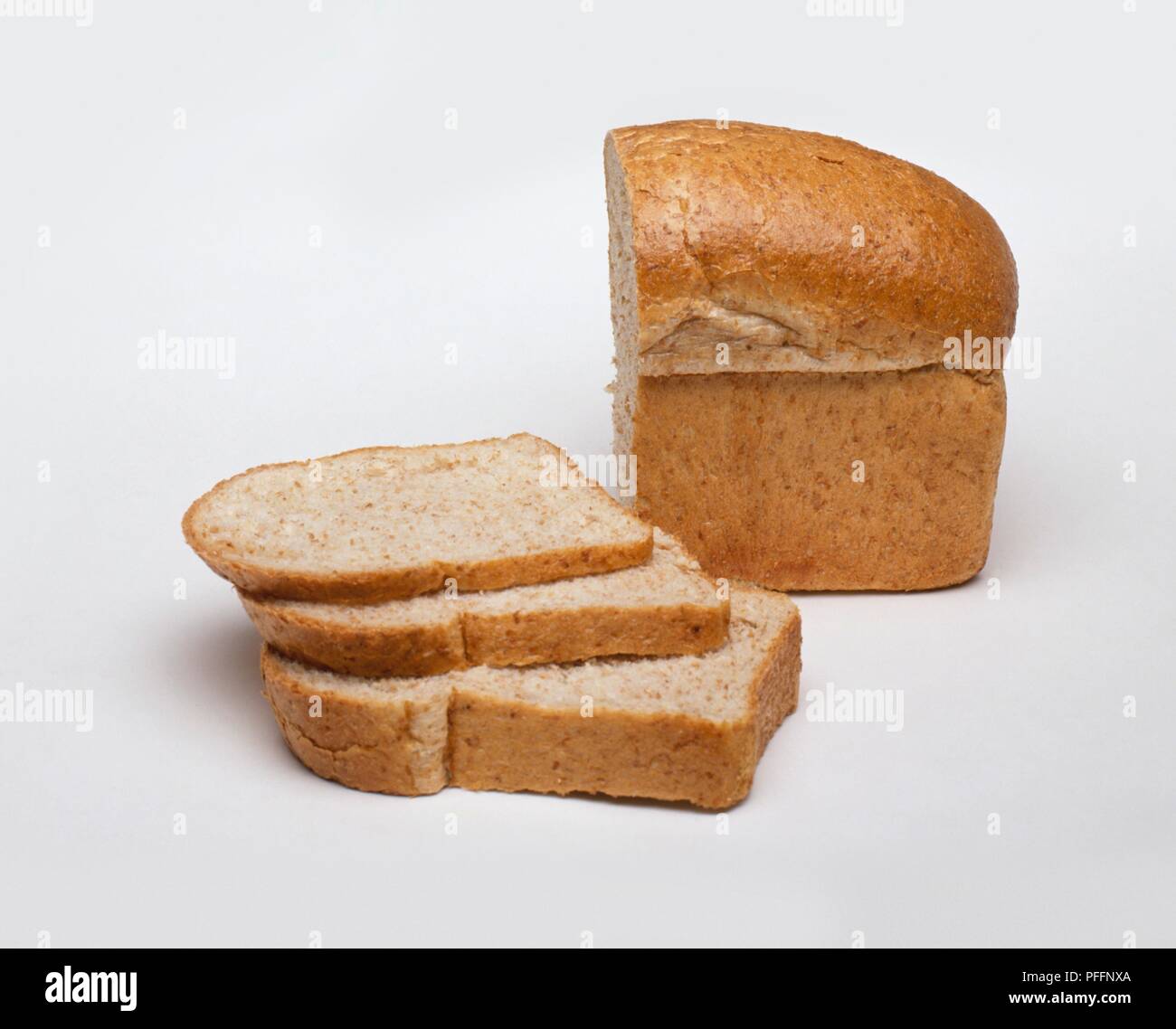 Loaf and slices of whole wheat bread Stock Photo - Alamy