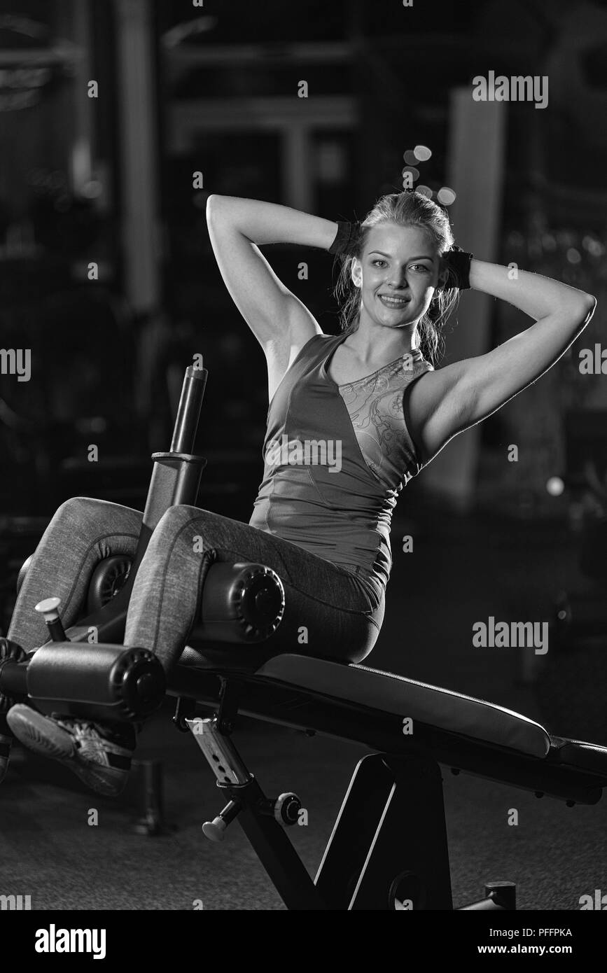 Woman doing strength exercises for abs muscles Stock Photo - Alamy