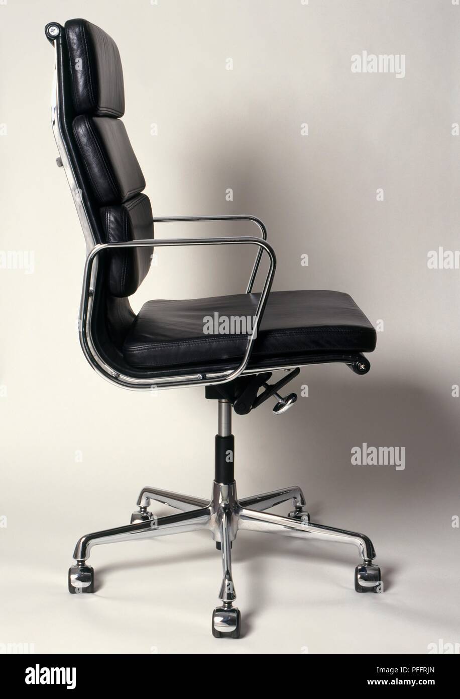 Leather and chrome office chair, side view Stock Photo - Alamy