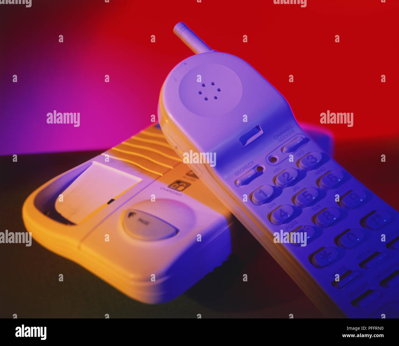 Cordless telephone handset leaning on its base unit Stock Photo - Alamy