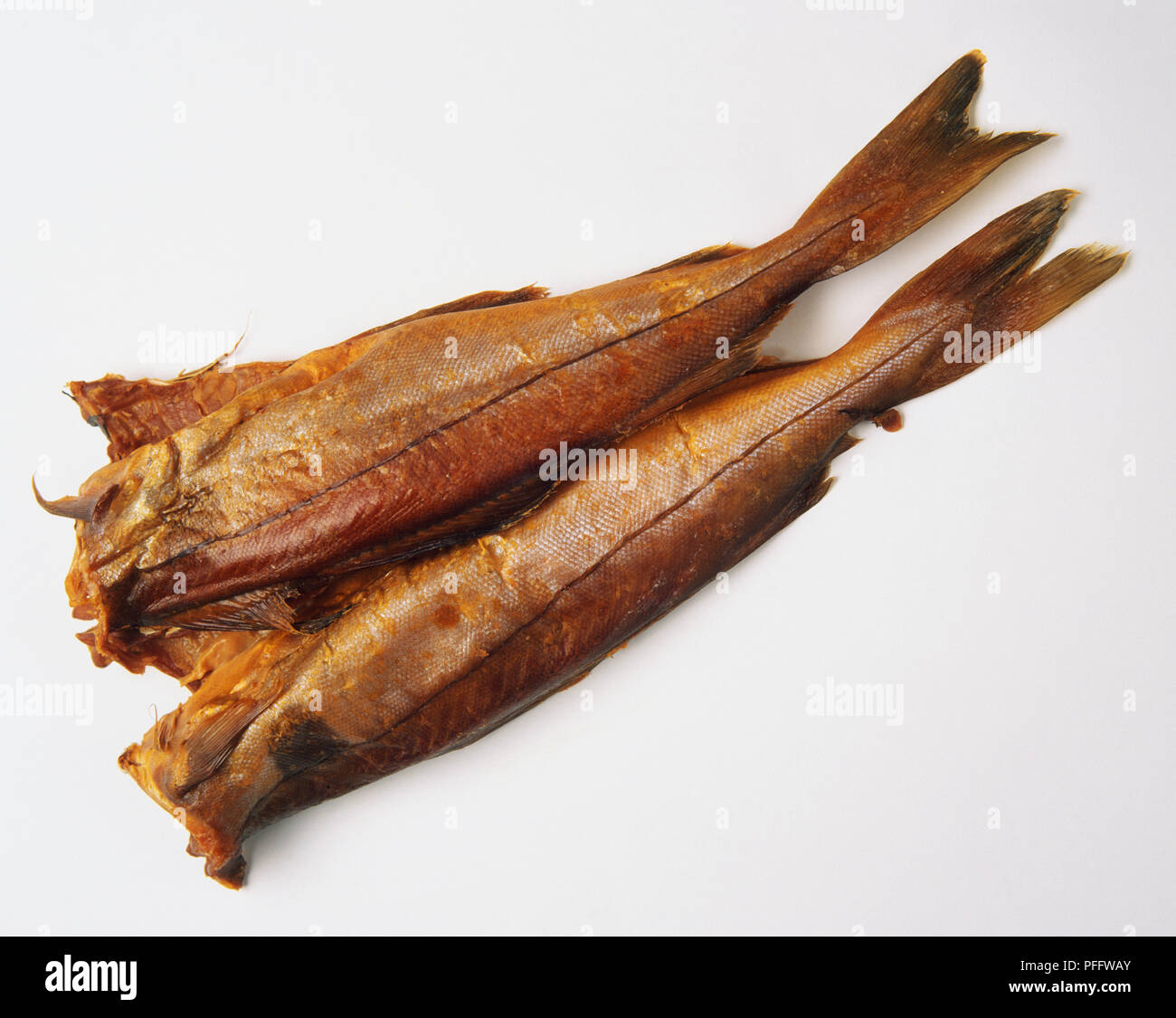 Two rich brown smoked Herring Stock Photo - Alamy
