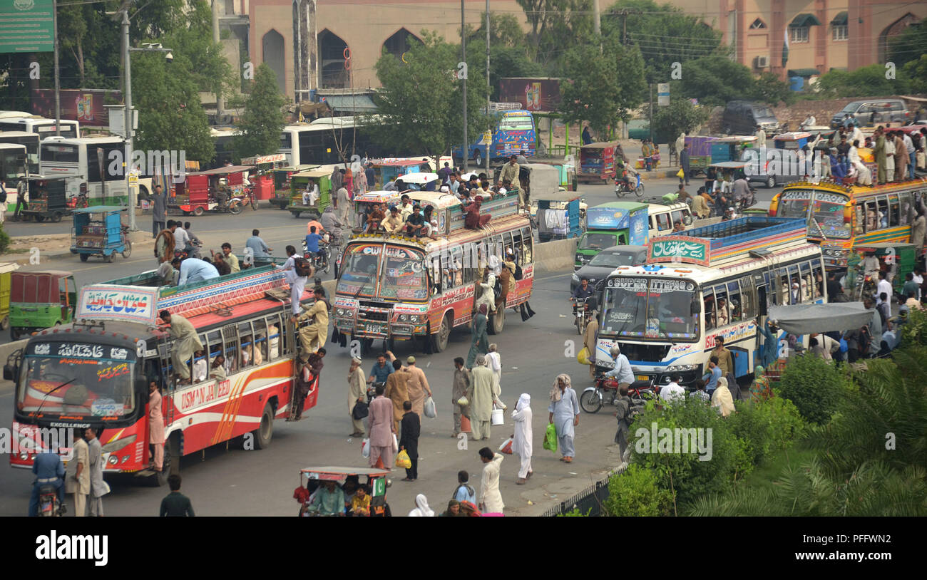 Pakistani passengers travel on a overcrowded bus to reach their ...
